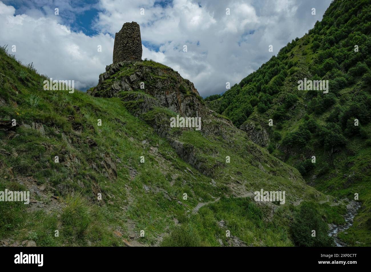 Stepantsminda, Georgia - June 30, 2024: Landscape with the ruins of the ...