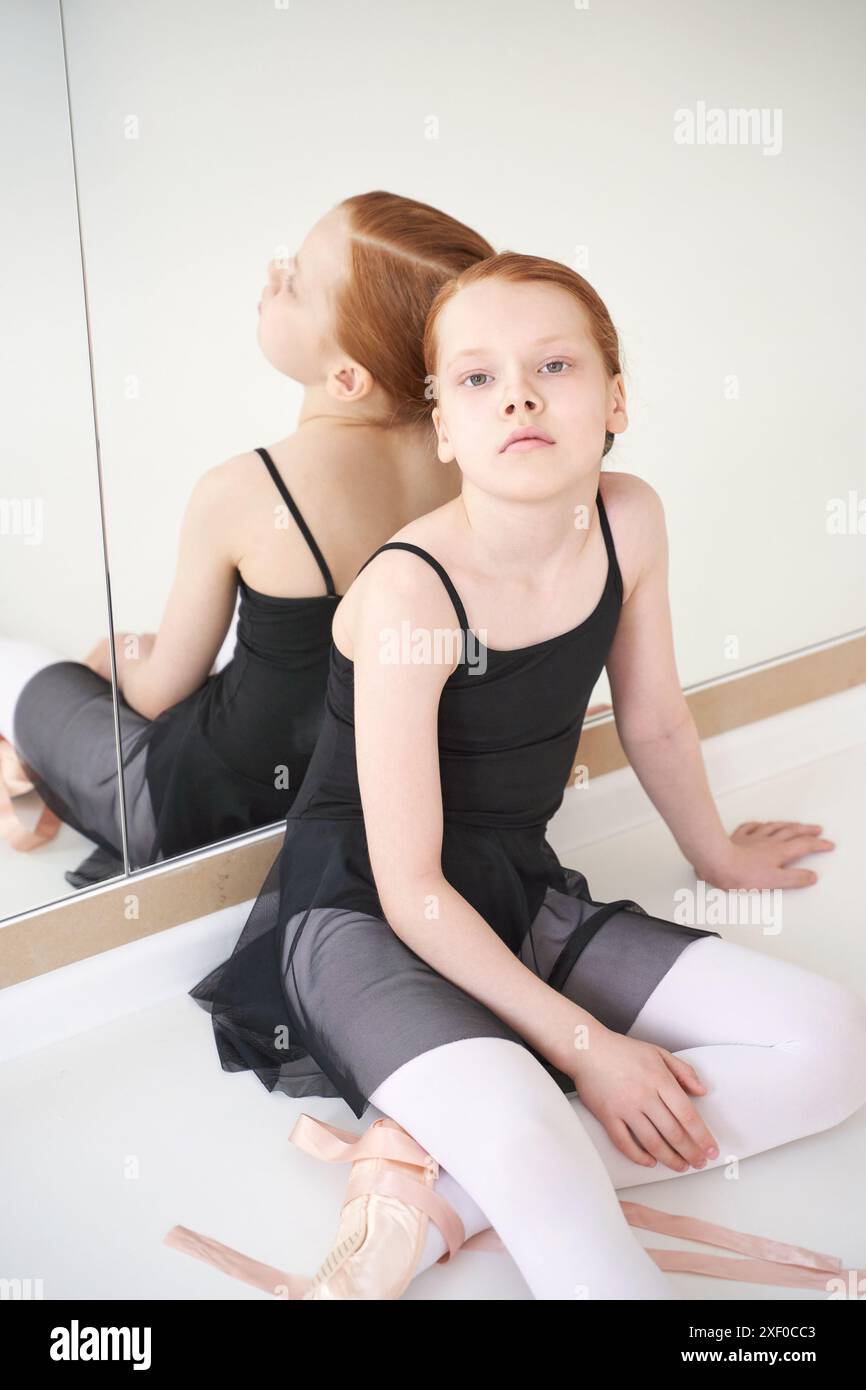 Young ballet girl at studio lesson. Portrait. Training performance ...