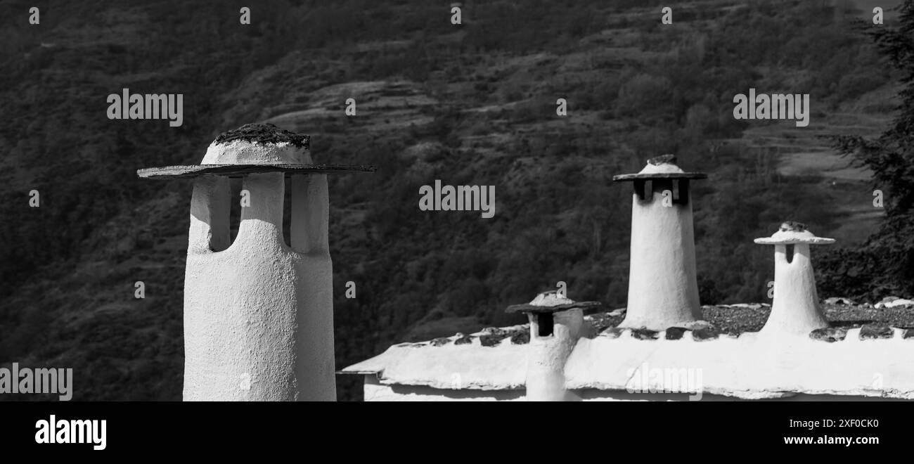 White stone chimneys with a slate stone on top, typical of the houses ...