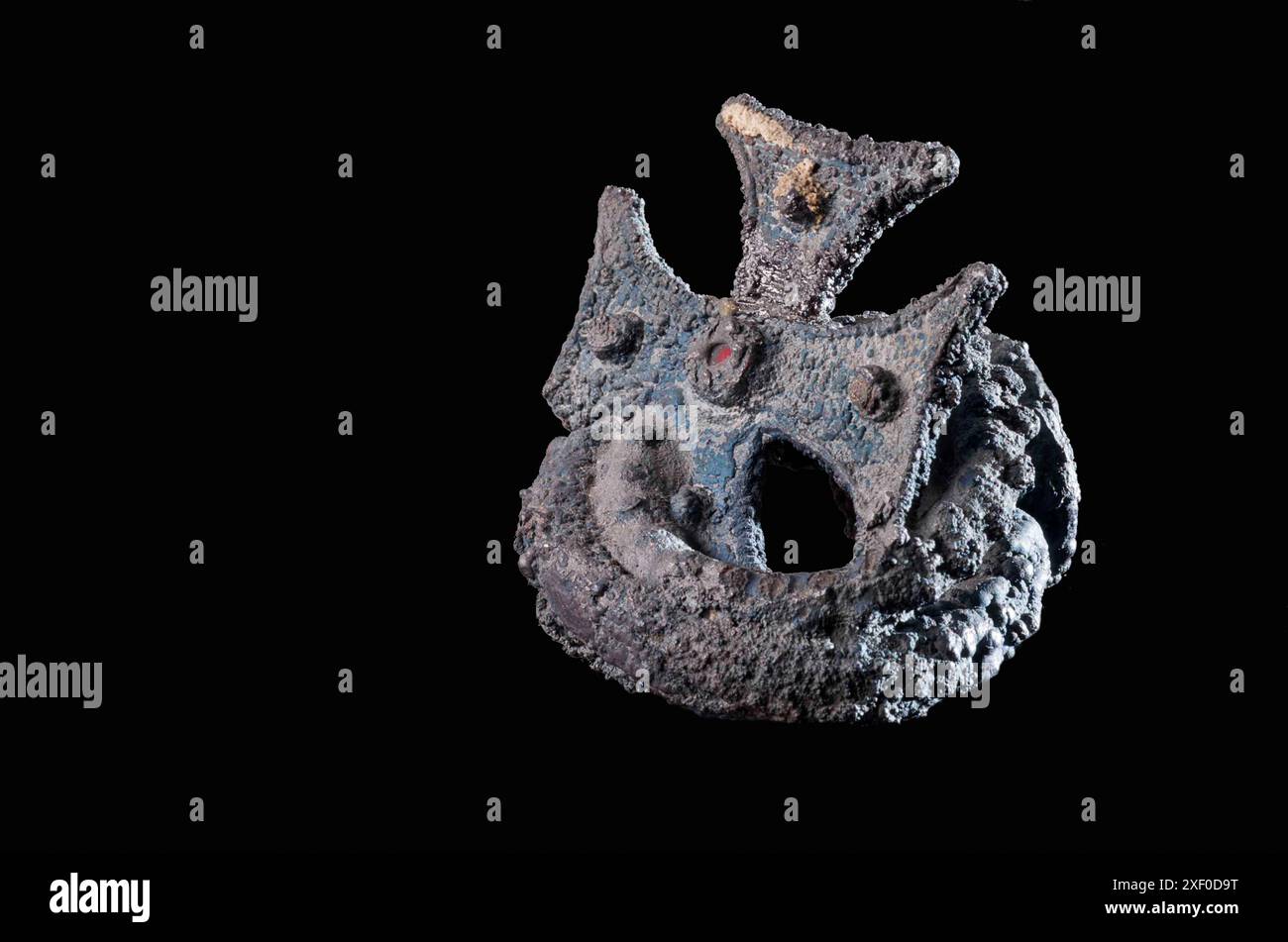 A silver pendant in the shape of a ‘Maltese’ cross set with a garnet ...