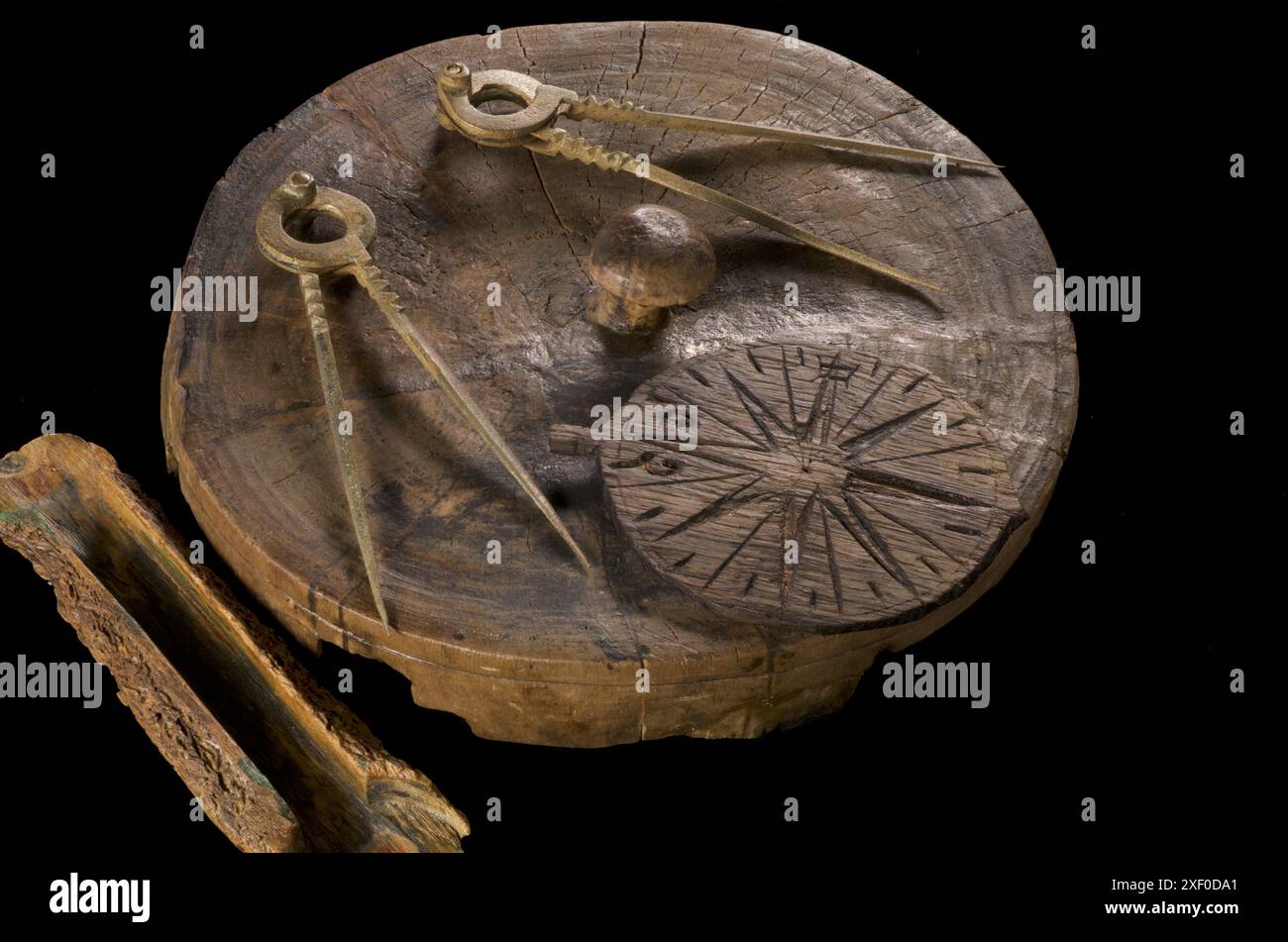 A selection of navigation tools, base and top of a round compass box ...