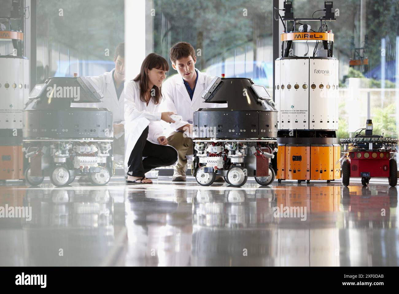 Researchers testing MiReLa guiding robot, Pioneer and Mugiro ...
