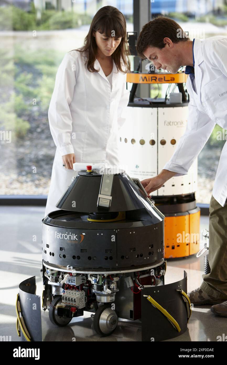 Researchers testing MiReLa guiding robot, Pioneer and Mugiro ...