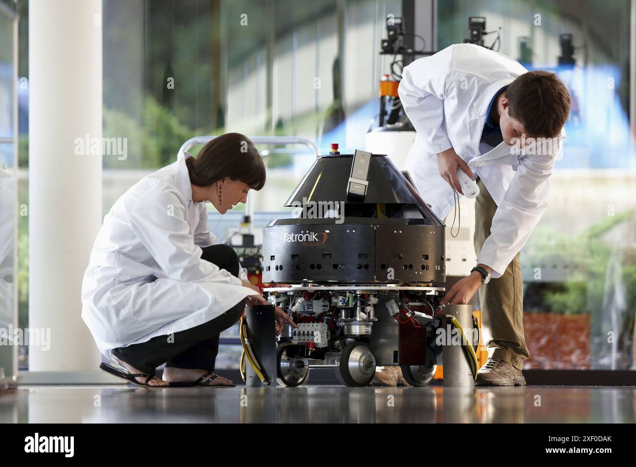 Researchers testing MiReLa guiding robot, Pioneer and Mugiro ...