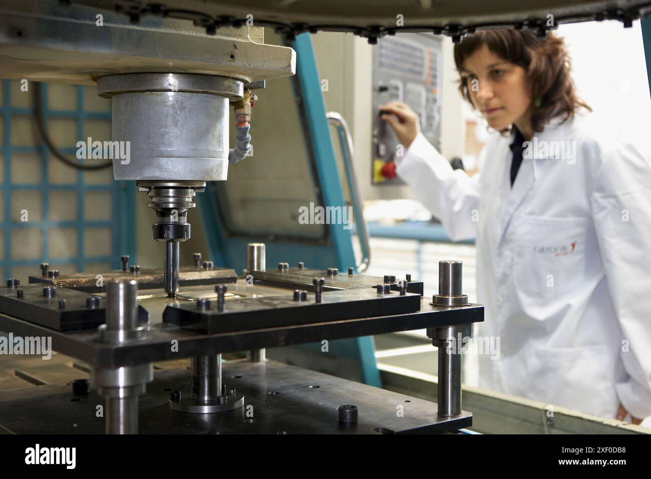 Researcher testing Anak-Matic 7 CNC vertical milling machine for ...