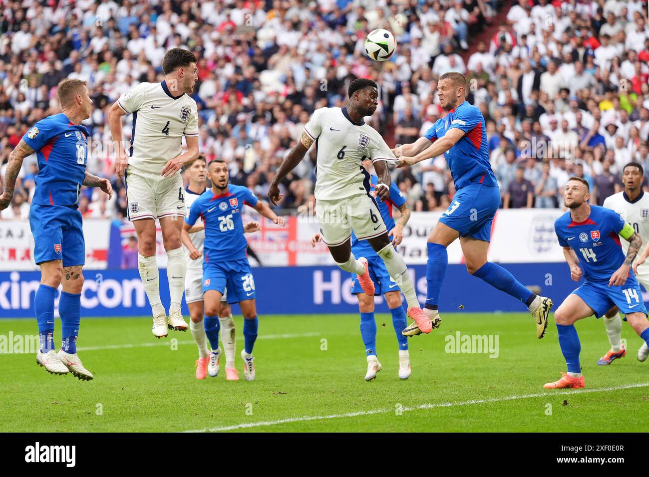 England's Marc Guehi and Slovakia's Denis Vavro battle for a header during the UEFA Euro 2024 ...