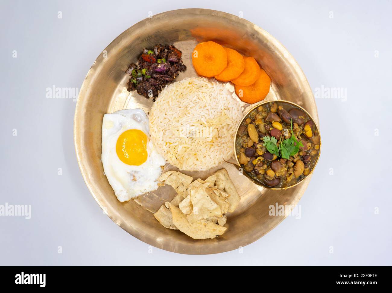 Nepali Thali Set with Kwati Mix Bean Soup, Rice, Omlette in a plate for ...