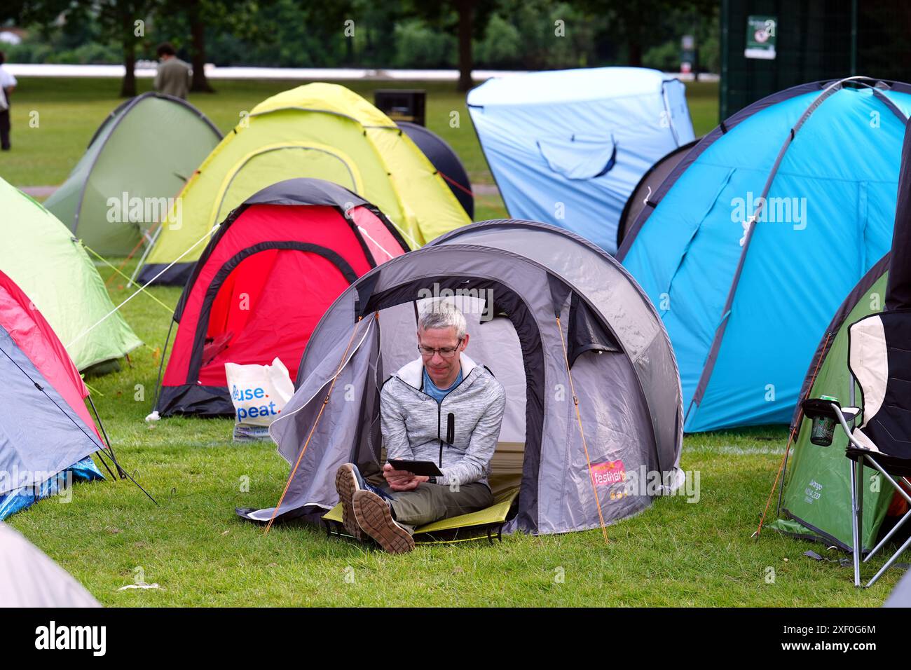A spectator in the overnight queue ahead of the Wimbledon championships ...