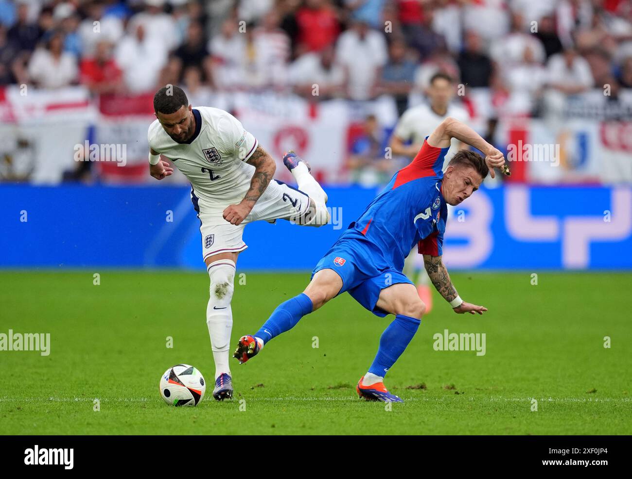 England's Kyle Walker (left) and Slovakia's Tomas Suslov battle for the ...