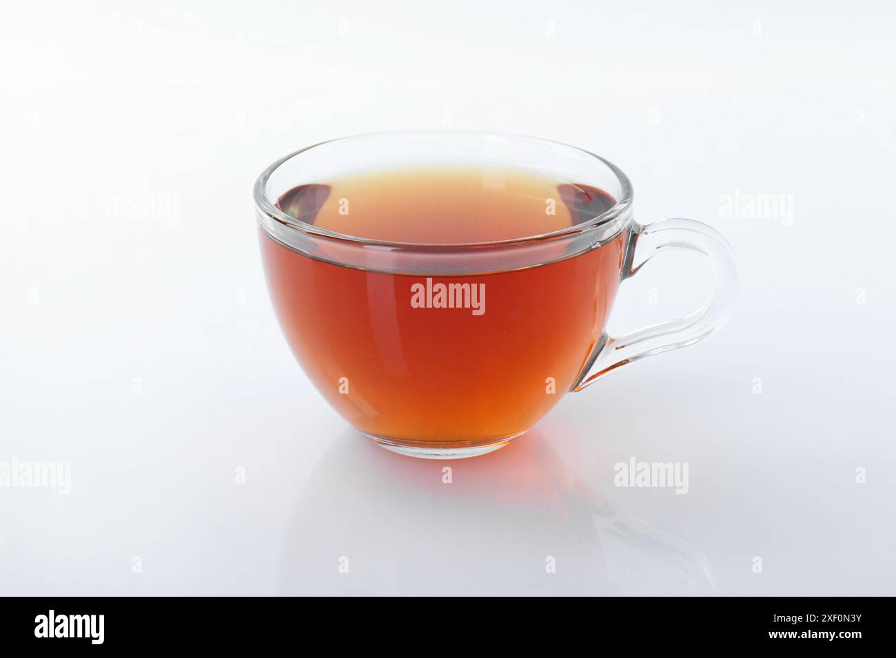 Tasty tea in cup on white background Stock Photo - Alamy