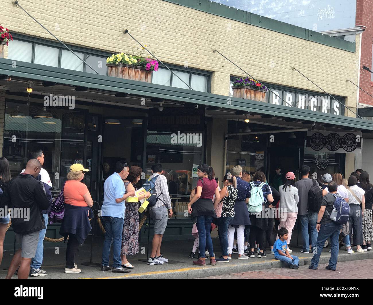 First Starbucks in Seattle has free coffee on anniversary; people wait ...