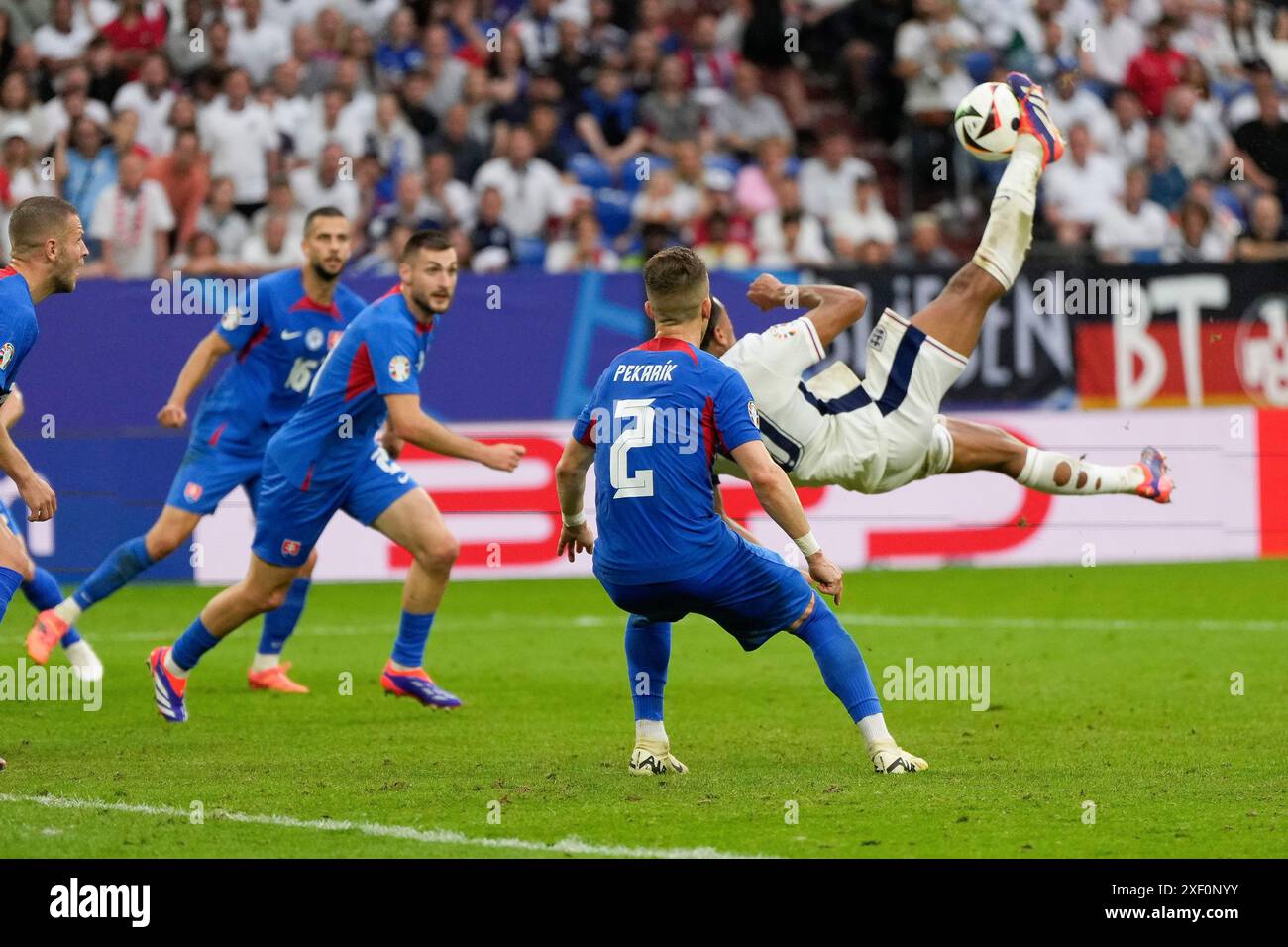 England's Jude Bellingham scores on a bicycle kick during a round of ...