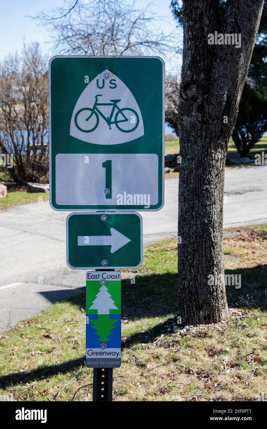 Bike trail and east coast greenway signs at the riverfront walkway in ...