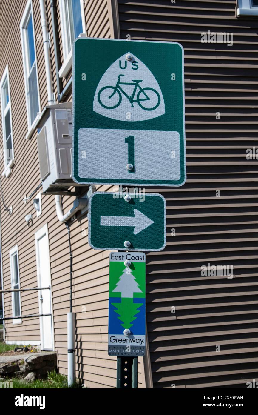 Bike trail and east coast greenway signs at the riverfront walkway in ...