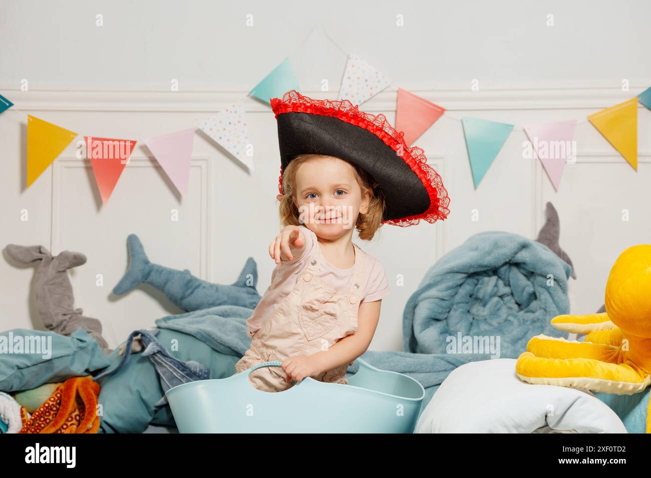 Child dressed as a pirate in playful, imaginative scene of sail Stock ...