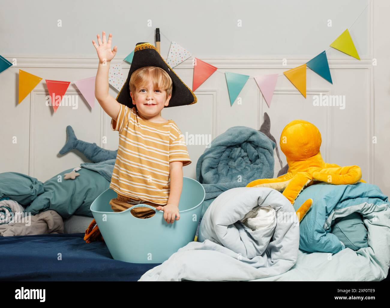 Happy kid in pirate disguise play sea adventurer at his bedroom Stock ...