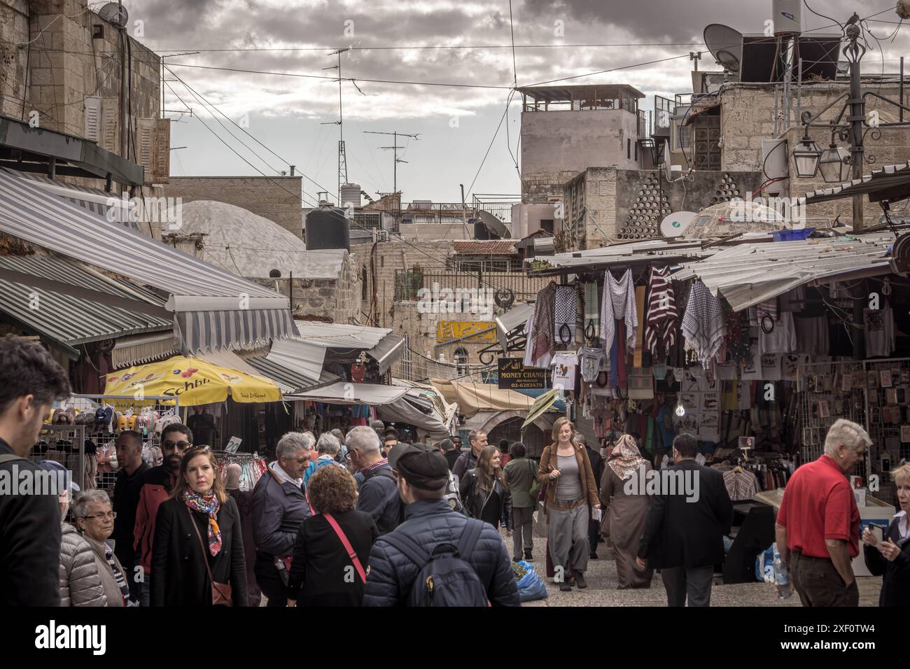 The tourists and local people are on the market (bazaar) at Jerusalem ...