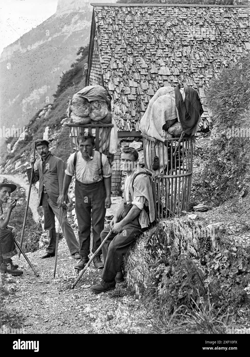 A group of men Porters with carrying equipment ('Säntisträger') in ...