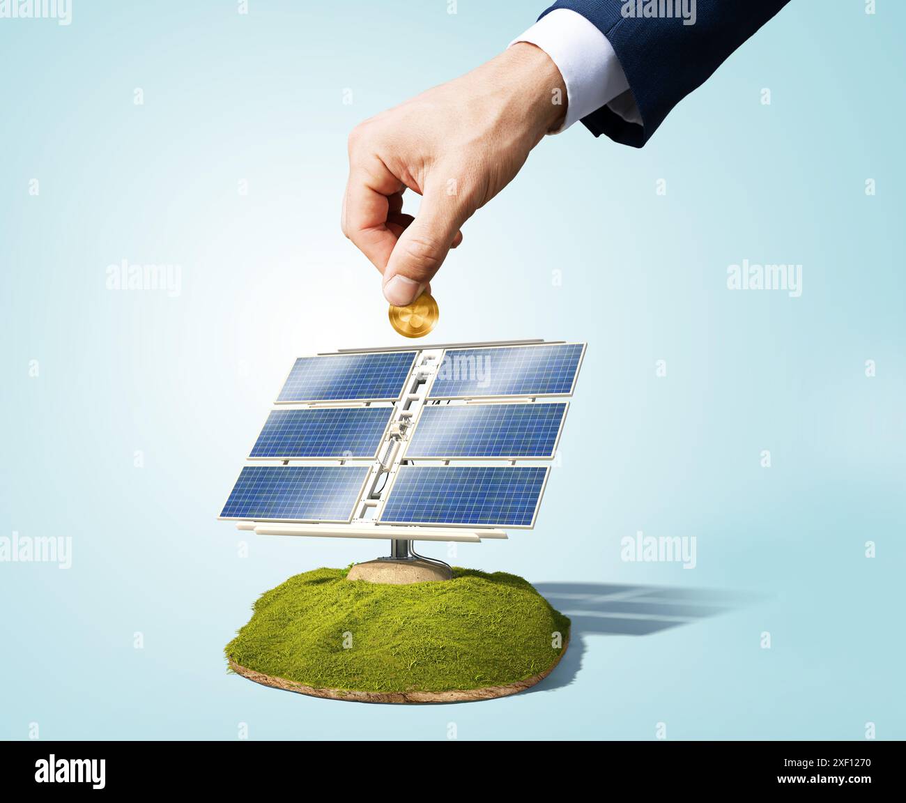 A hand is inserting a coin into a solar panel system Stock Photo - Alamy