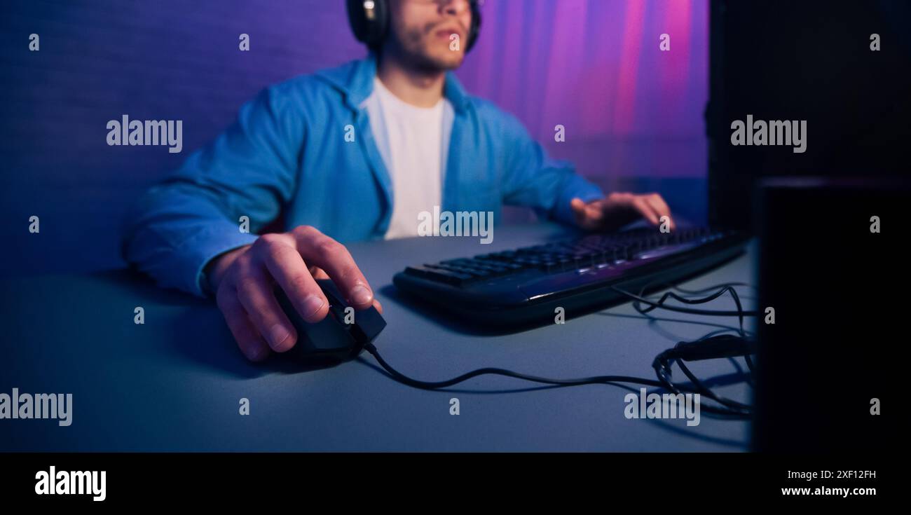 Man Using Computer Mouse and Keyboard While Gaming at Night Stock Photo ...