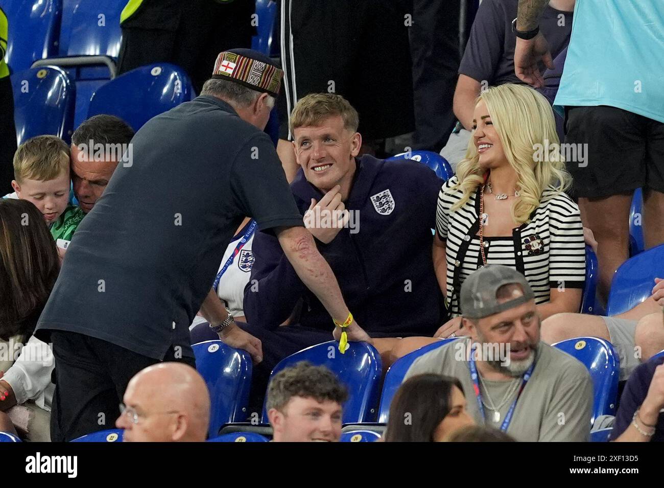 England goalkeeper Jordan Pickford (centre) in the stands with his ...