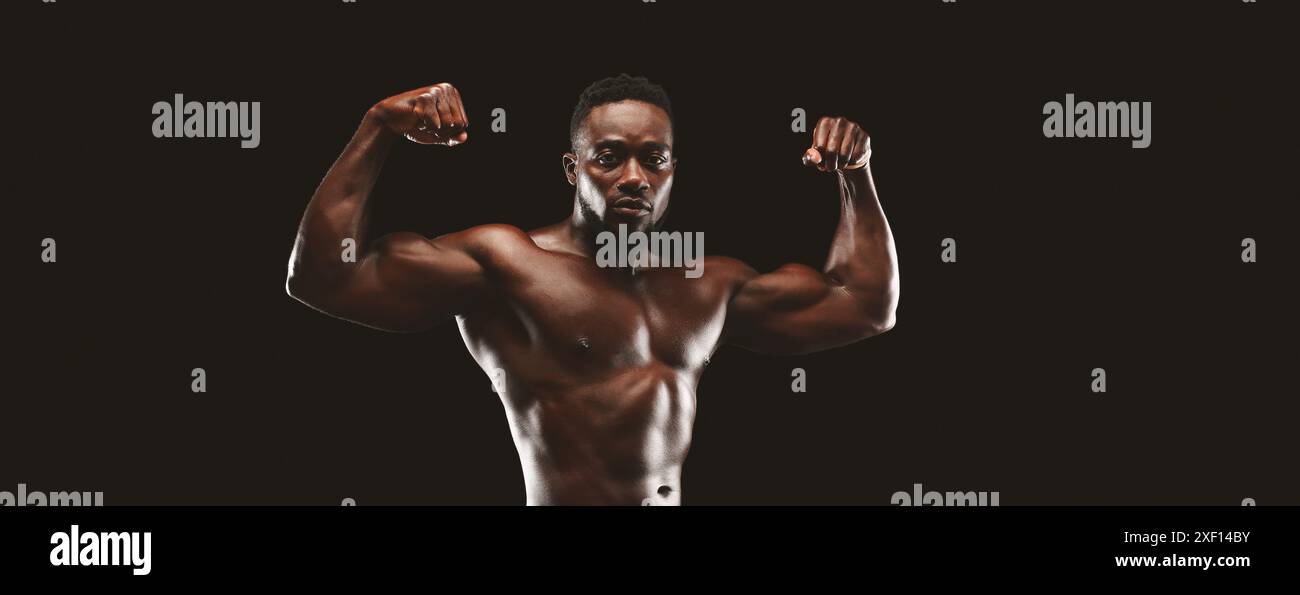 Muscular Man Flexing Biceps Stock Photo - Alamy