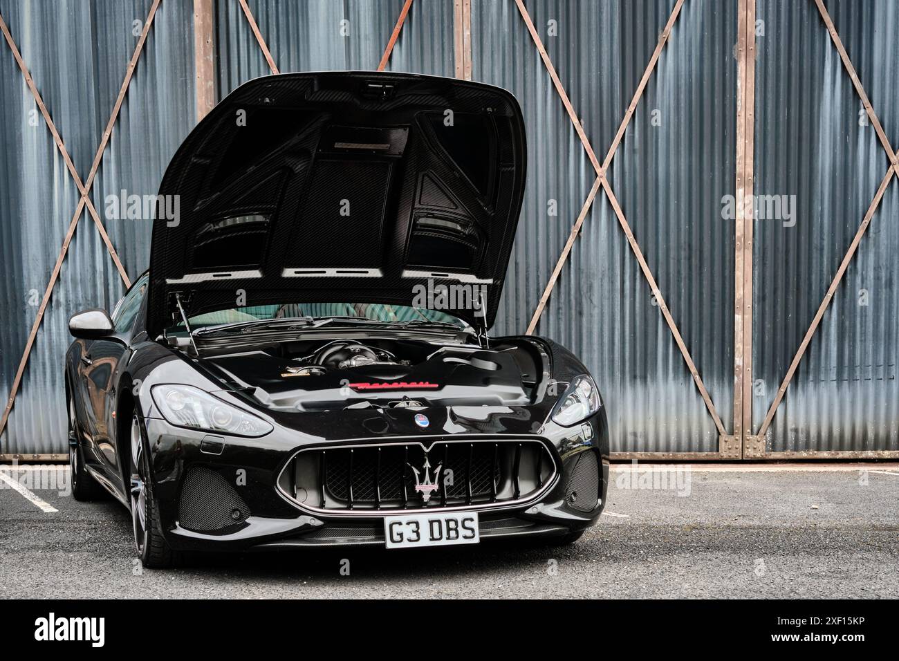 A black 2018 Maserati Gran Turismo MC Stradale Coupe with the bonnet up ...