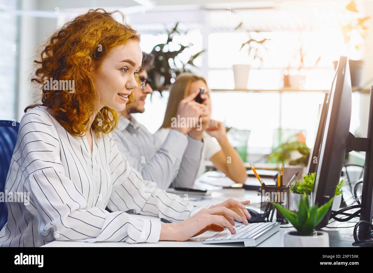 Young busy staff of employees working on computers Stock Photo - Alamy