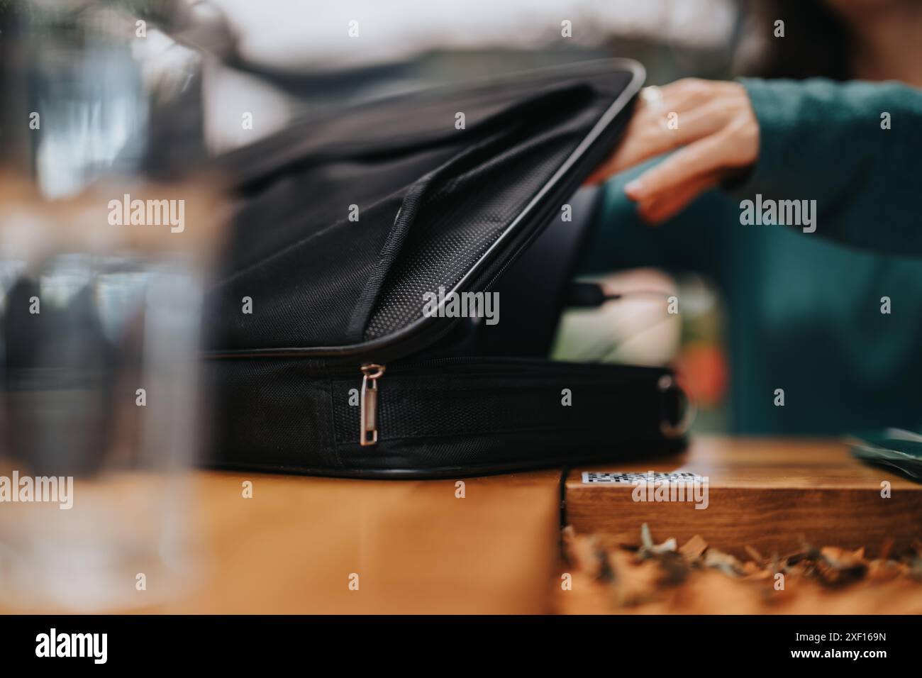 Professional woman packing a briefcase at a business meeting Stock ...