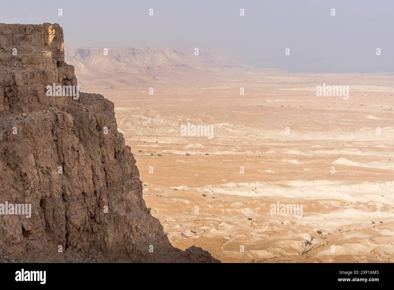 The tall cliff on the edge of Judean desert and rocky desert in the ...