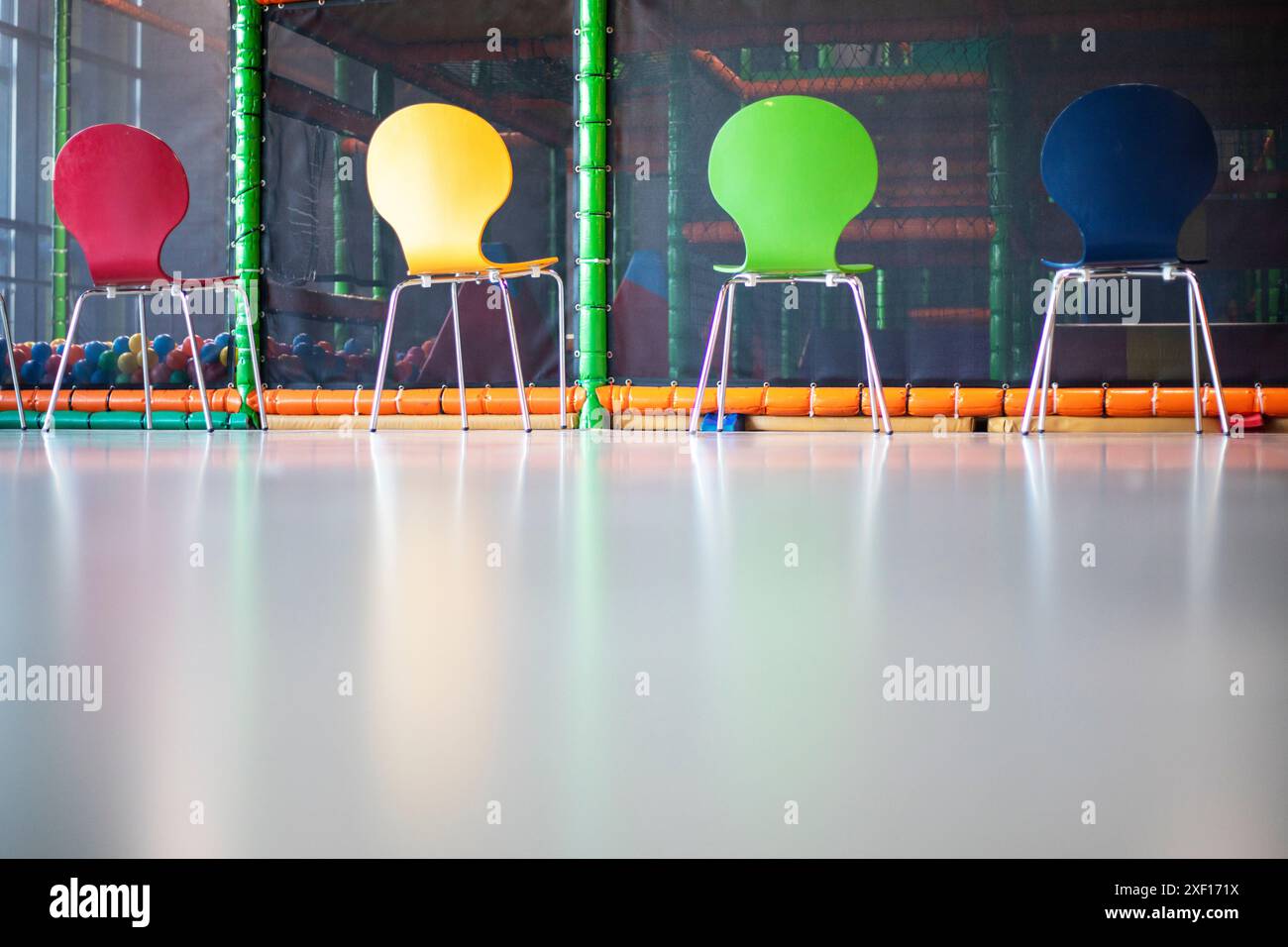 multi-colored modern chairs in the interior Stock Photo - Alamy
