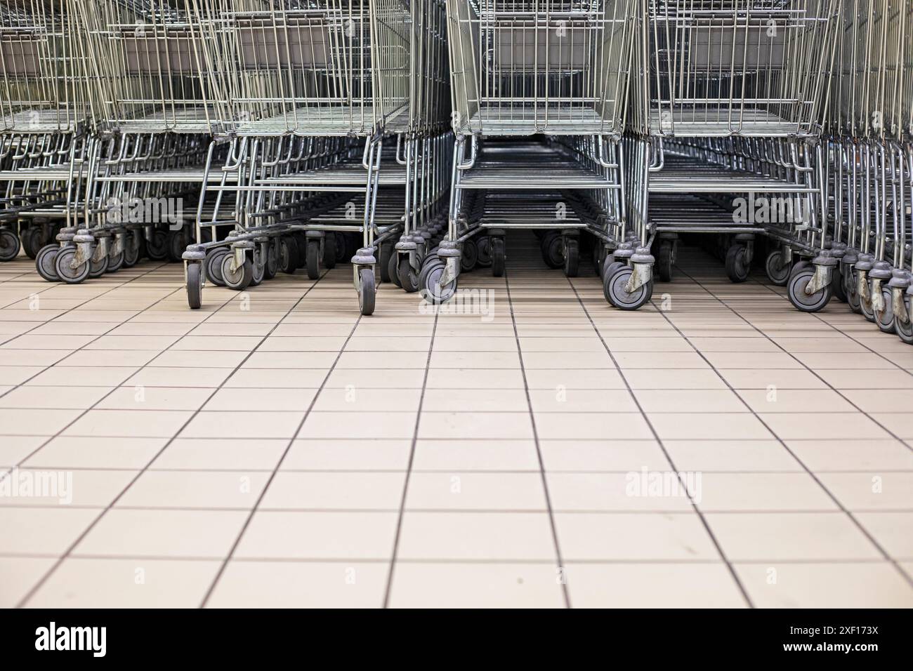 metal carts for products stacked on top of each other in front of the ...