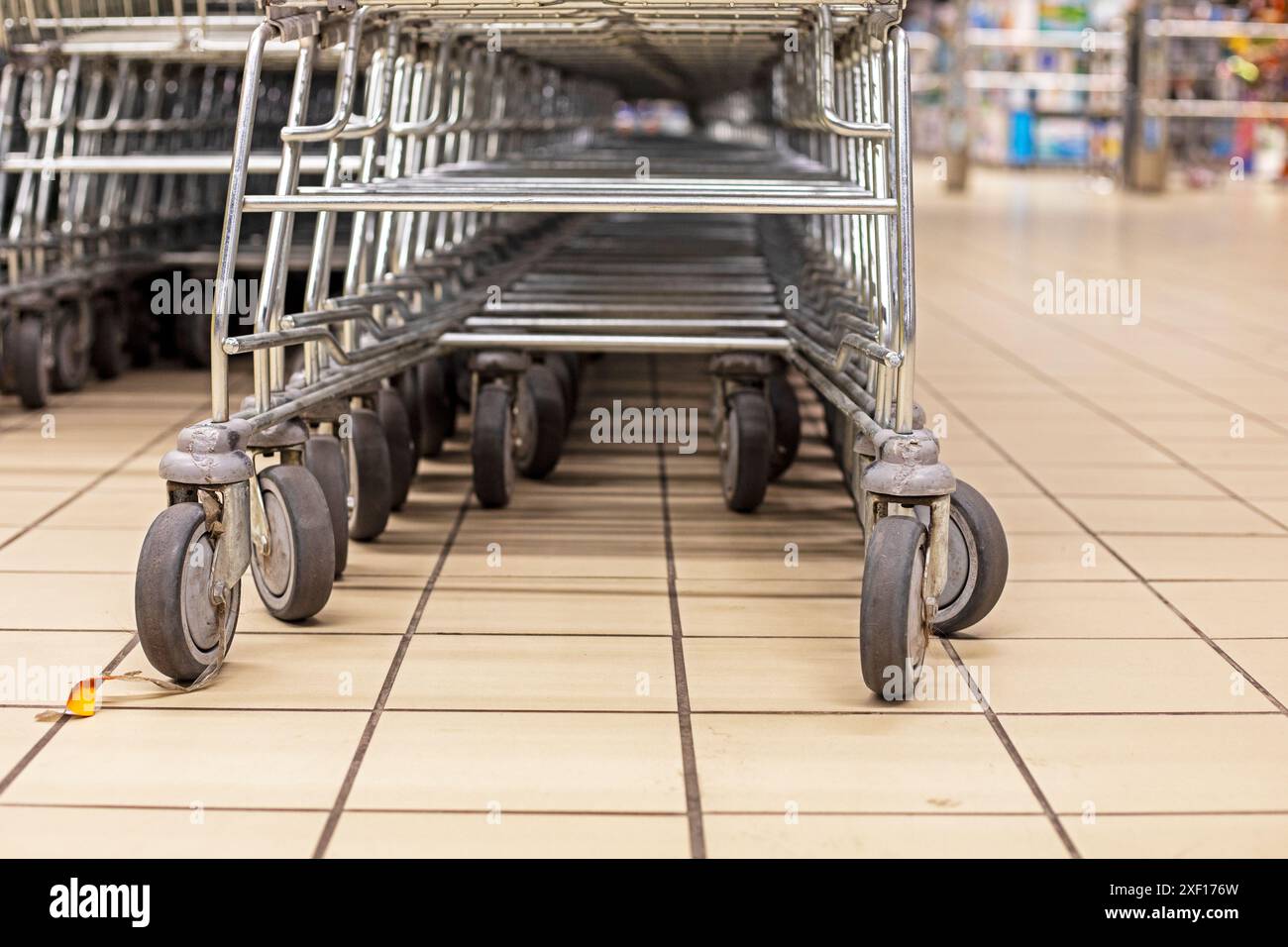close-up of metal carts for products stacked on top of each other in ...