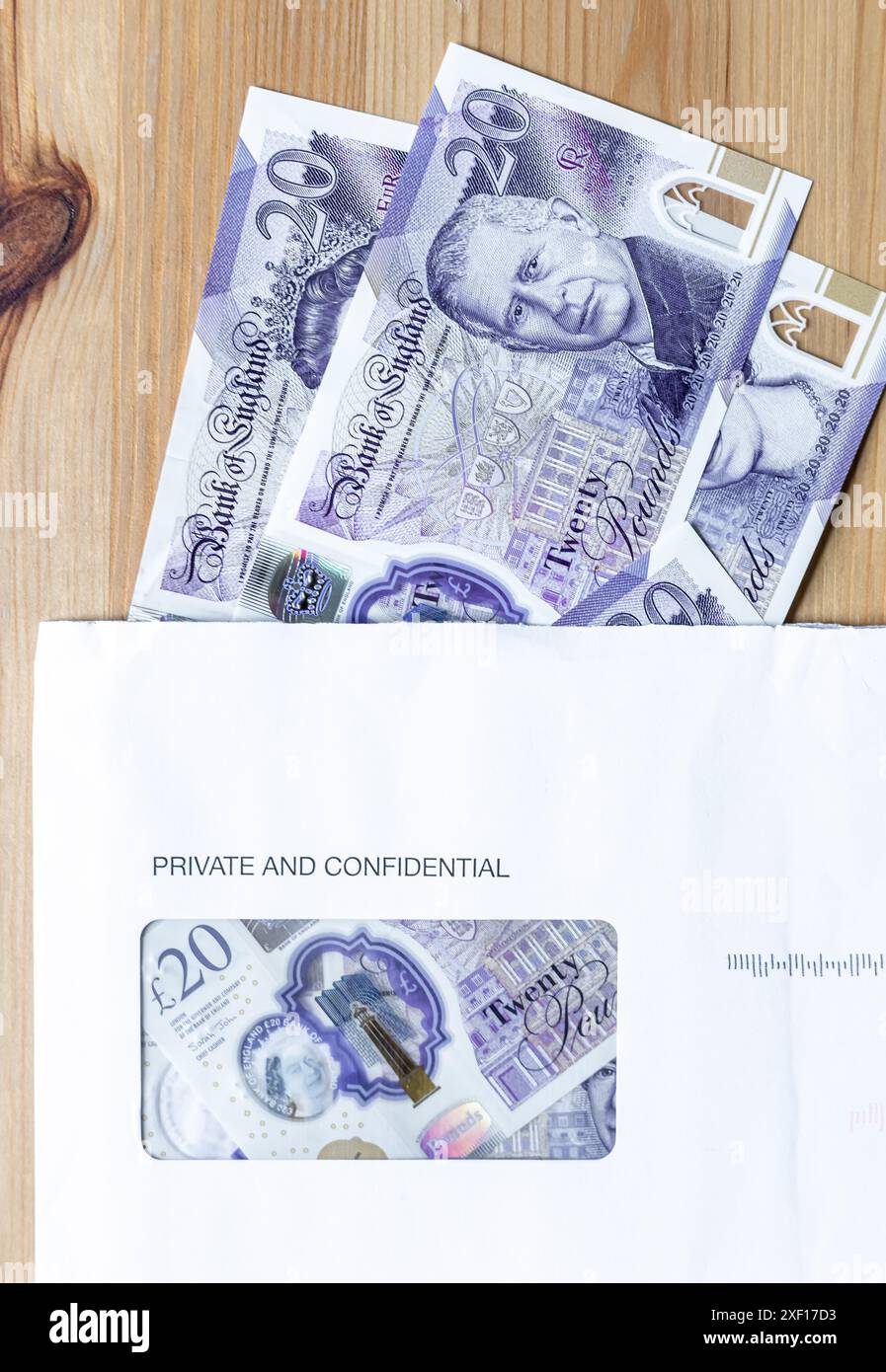 Cash in envleope, banknotes featuring a portrait of King Charles III ...