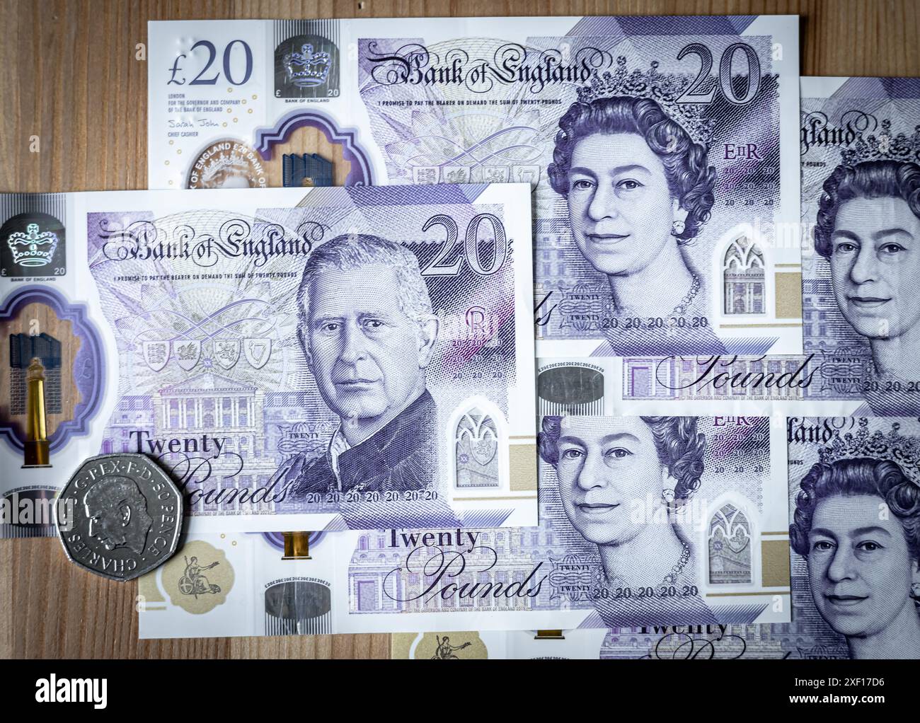 Banknotes featuring a portrait of King Charles III and late Queen ...