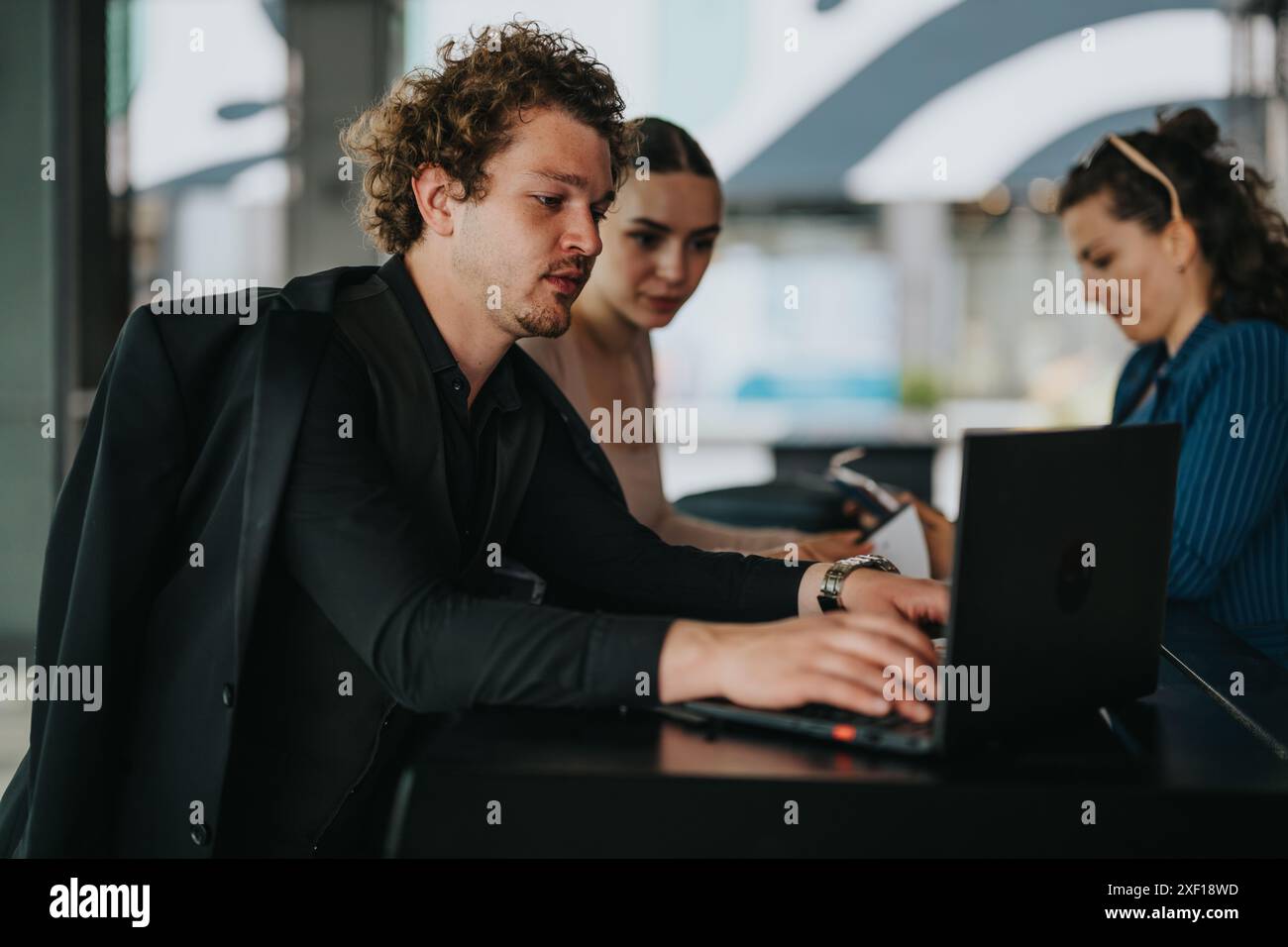 Engaged team members collaborate in hi-res stock photography and images ...