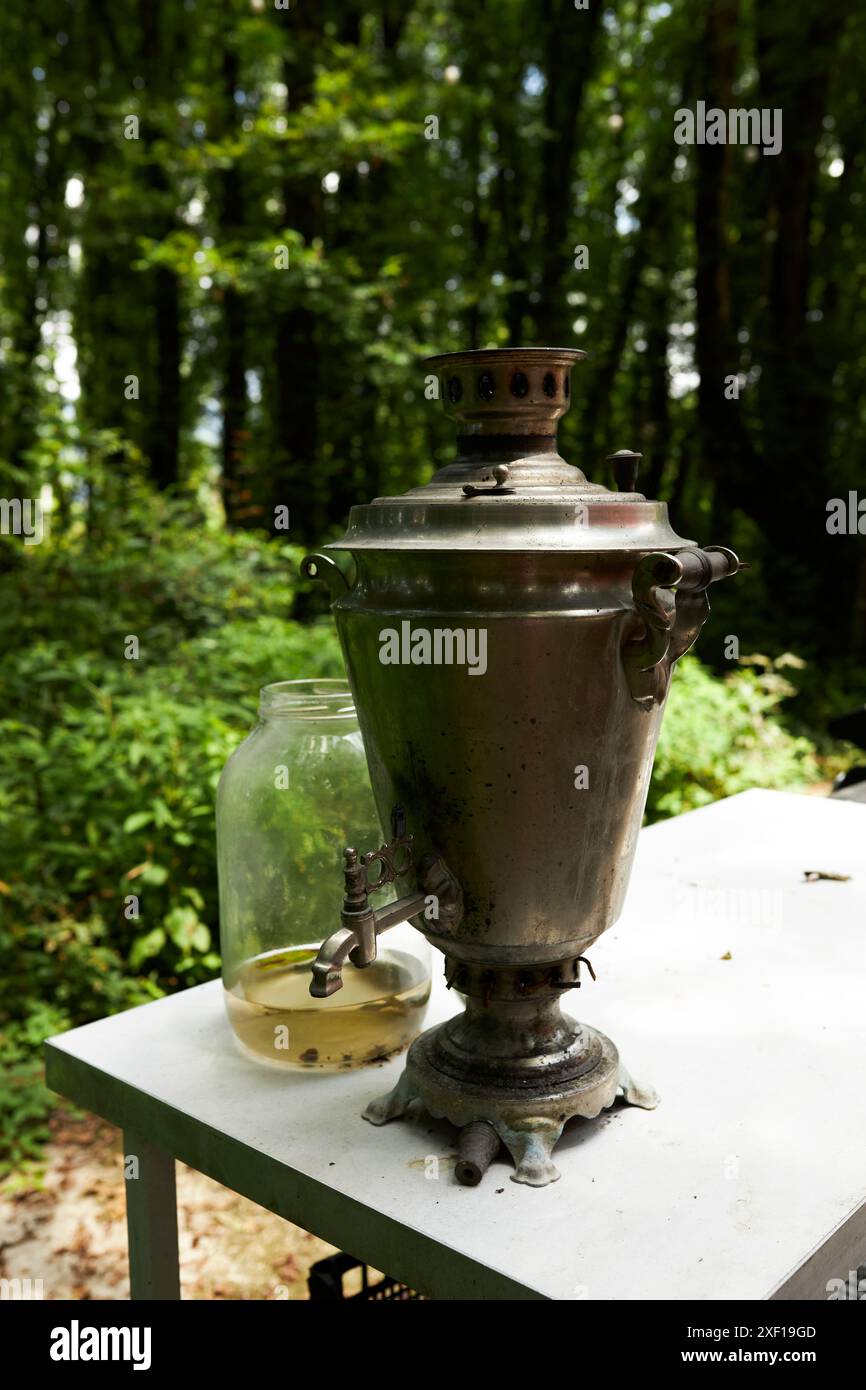 Antique burning samovar in nature. traditional village tea Stock Photo ...