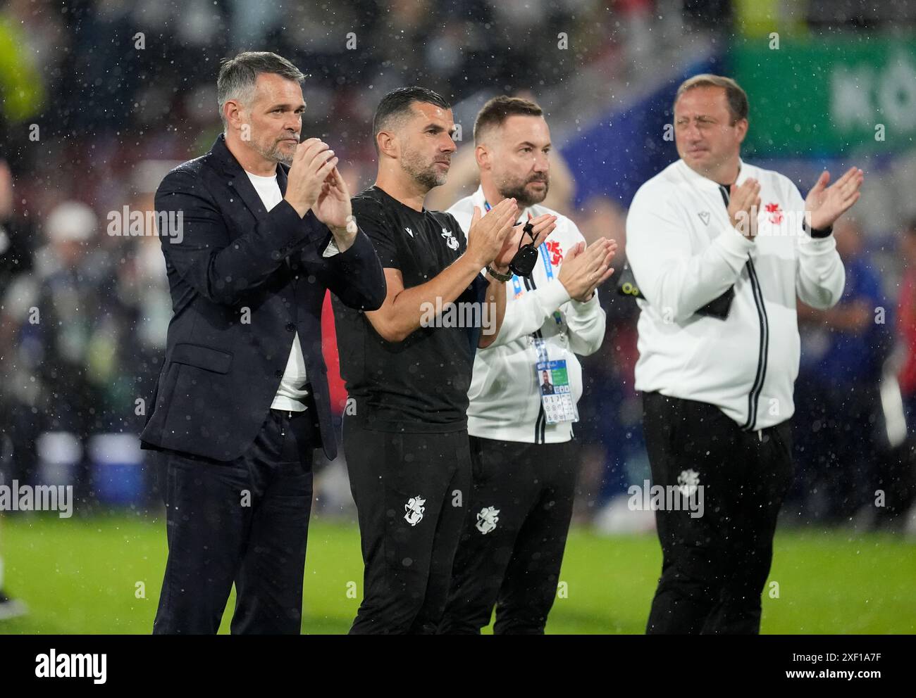 Georgia manager Willy Sagnol (left) applauds the fans after the UEFA ...