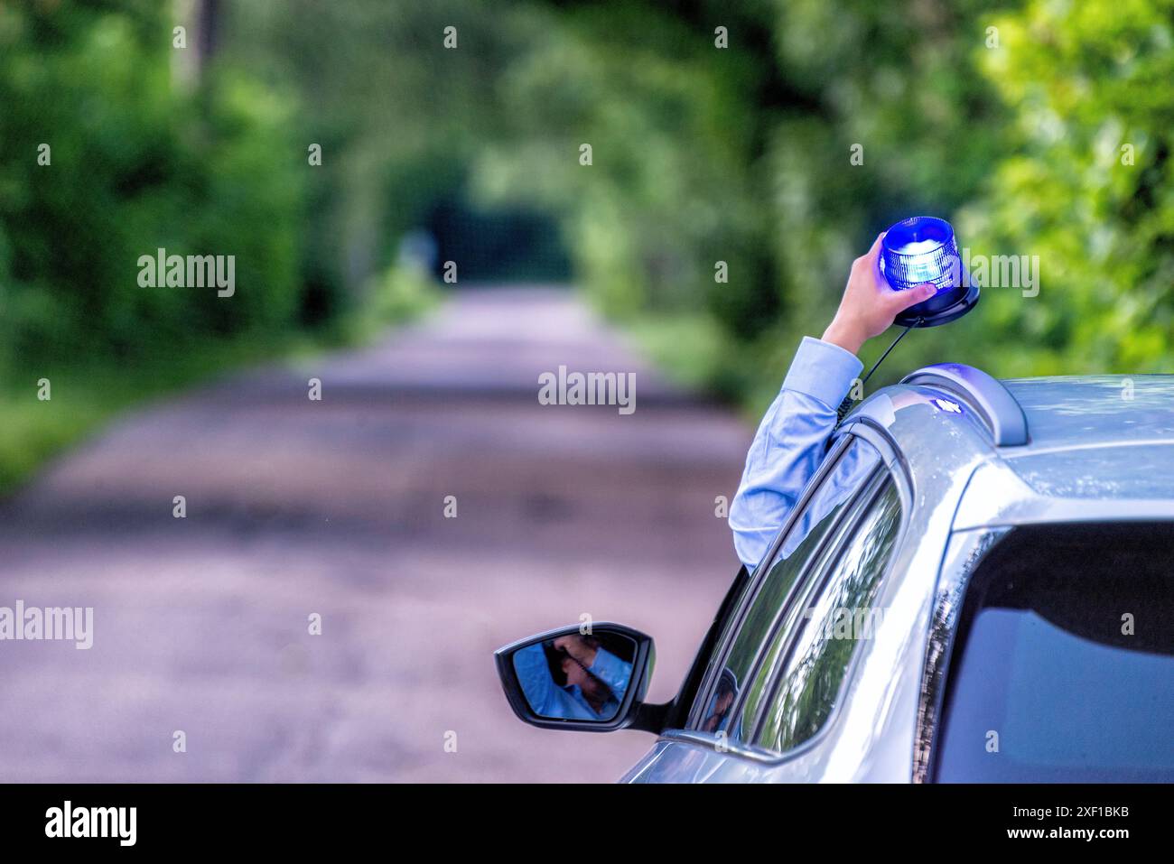 blue flashing light on a police car during a blue light drive Stock ...