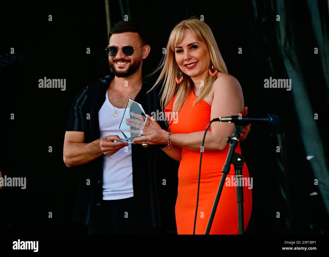 LONDON, UK. 30th June, 2024. Host Duygu Tacmac awards Huseyin Erdinc ...