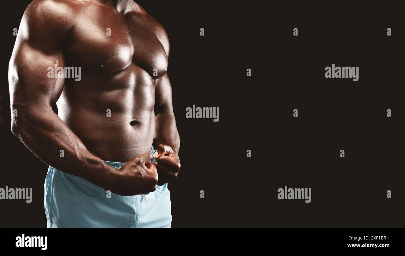 Muscular Man Posing With Flexed Bicep Stock Photo - Alamy
