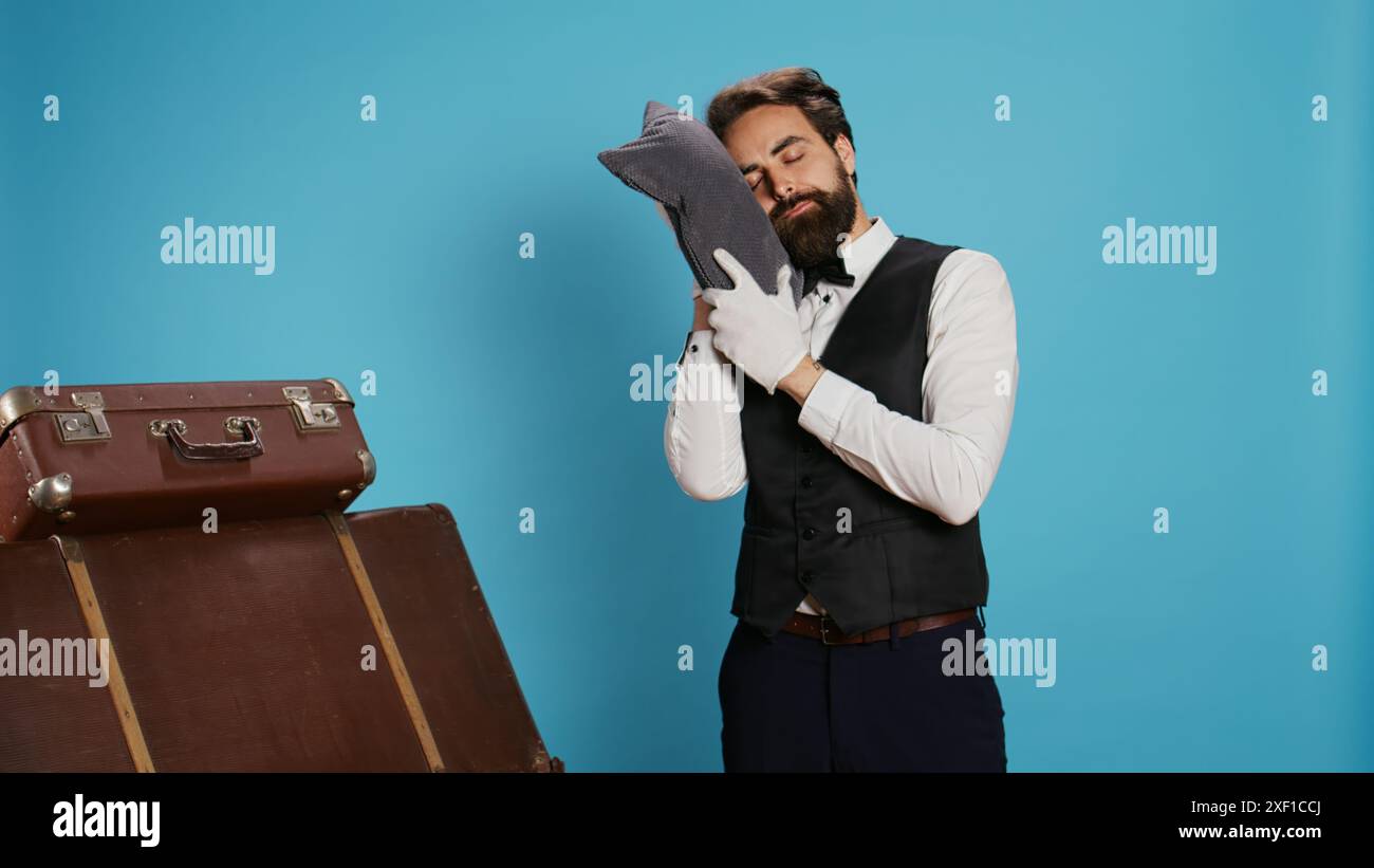 Tired doorman sleeping on pillow hi-res stock photography and images ...