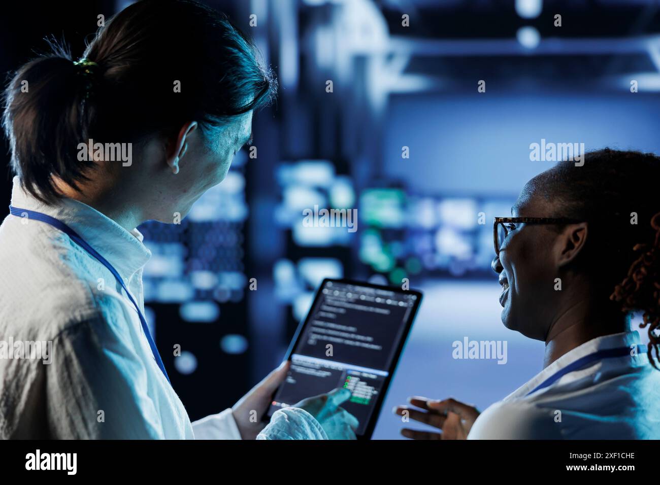 Engineer and african american colleague building firewall systems in ...