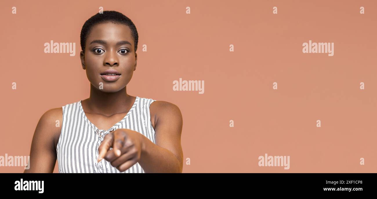 Woman pointing serious expression hi-res stock photography and images ...