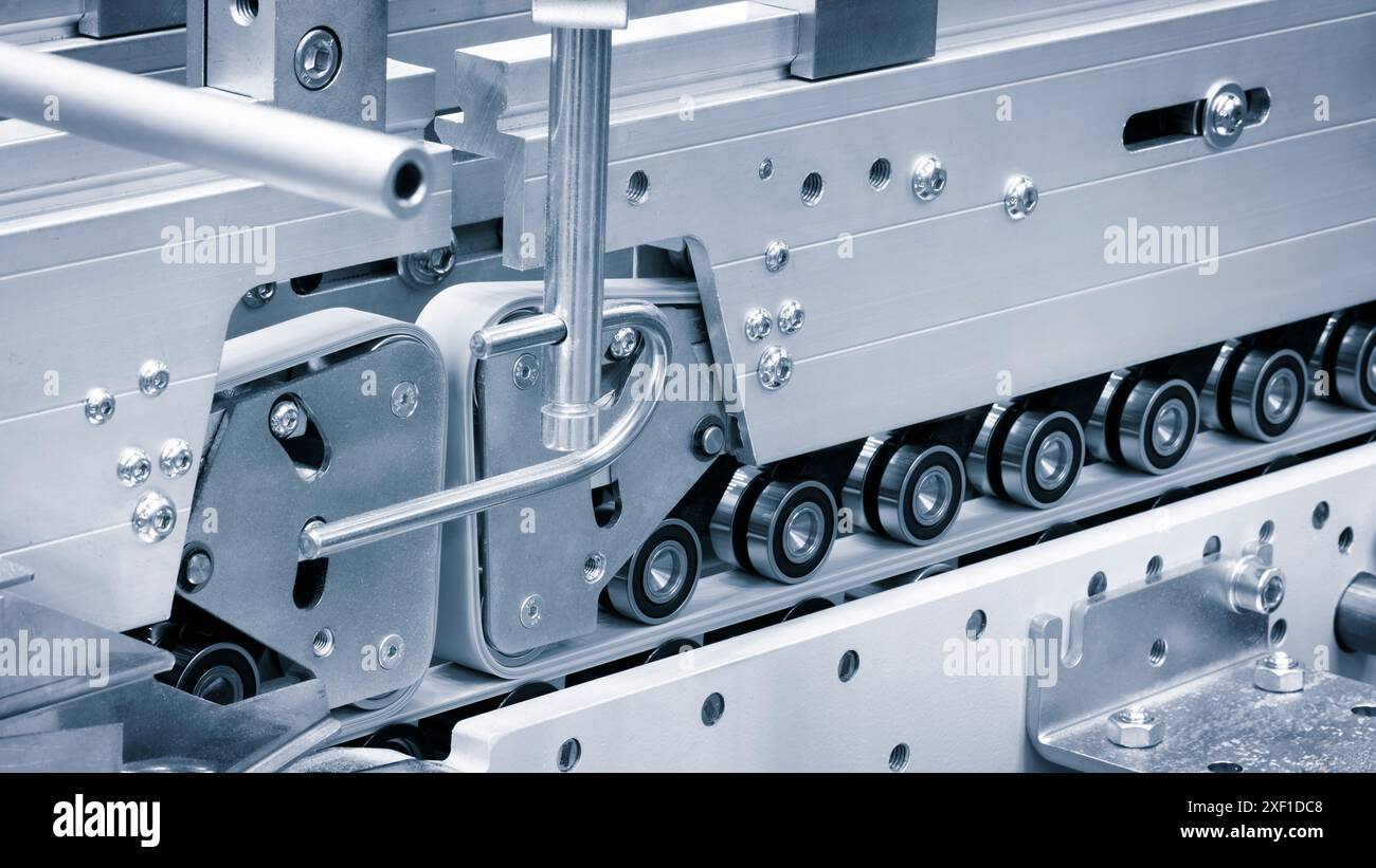 Part of a modern roller conveyor with metal and plastic rollers for the ...