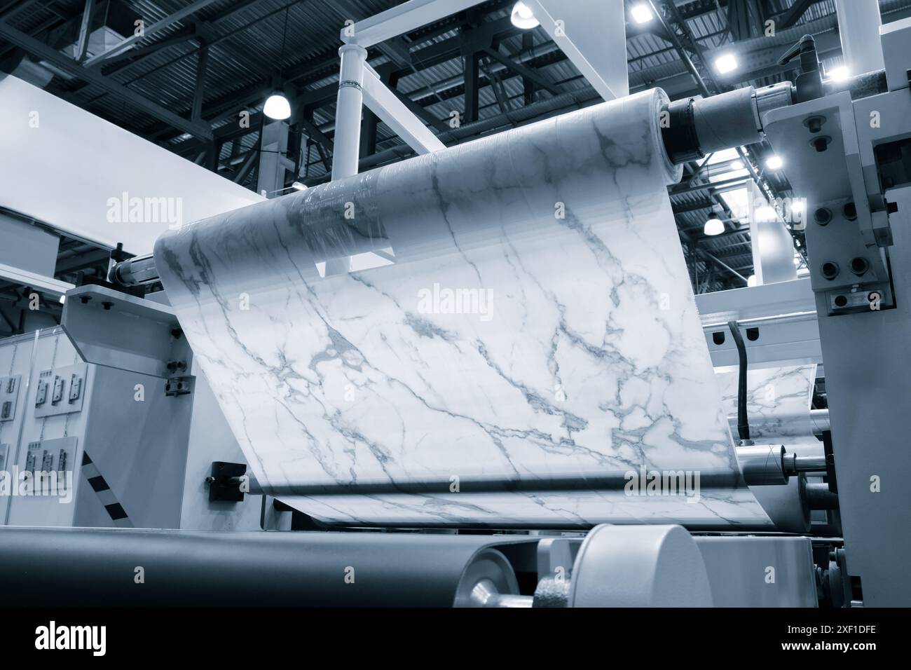 At the factory, a roll of polyethylene plastic film with a marble ...