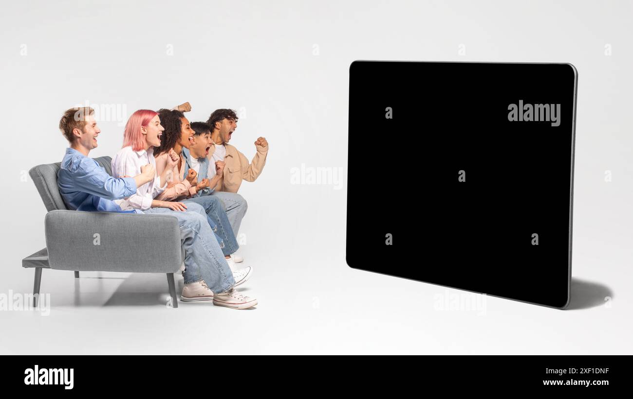 Diverse Group of Friends Watching Television on Couch Stock Photo - Alamy
