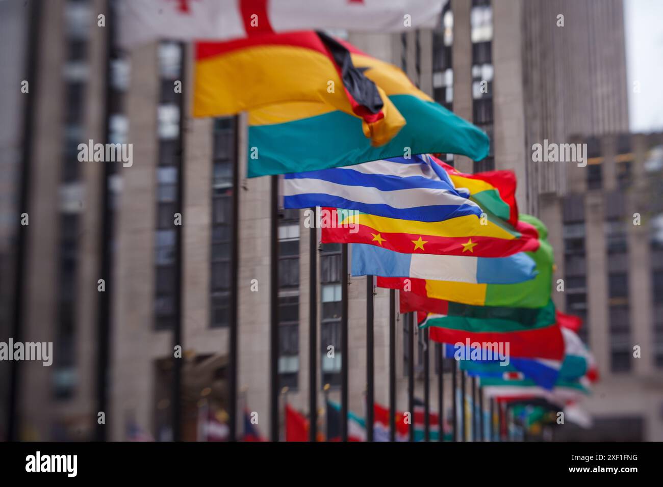 Detail of the Country Flag poles and the facade of the Rockefeller ...