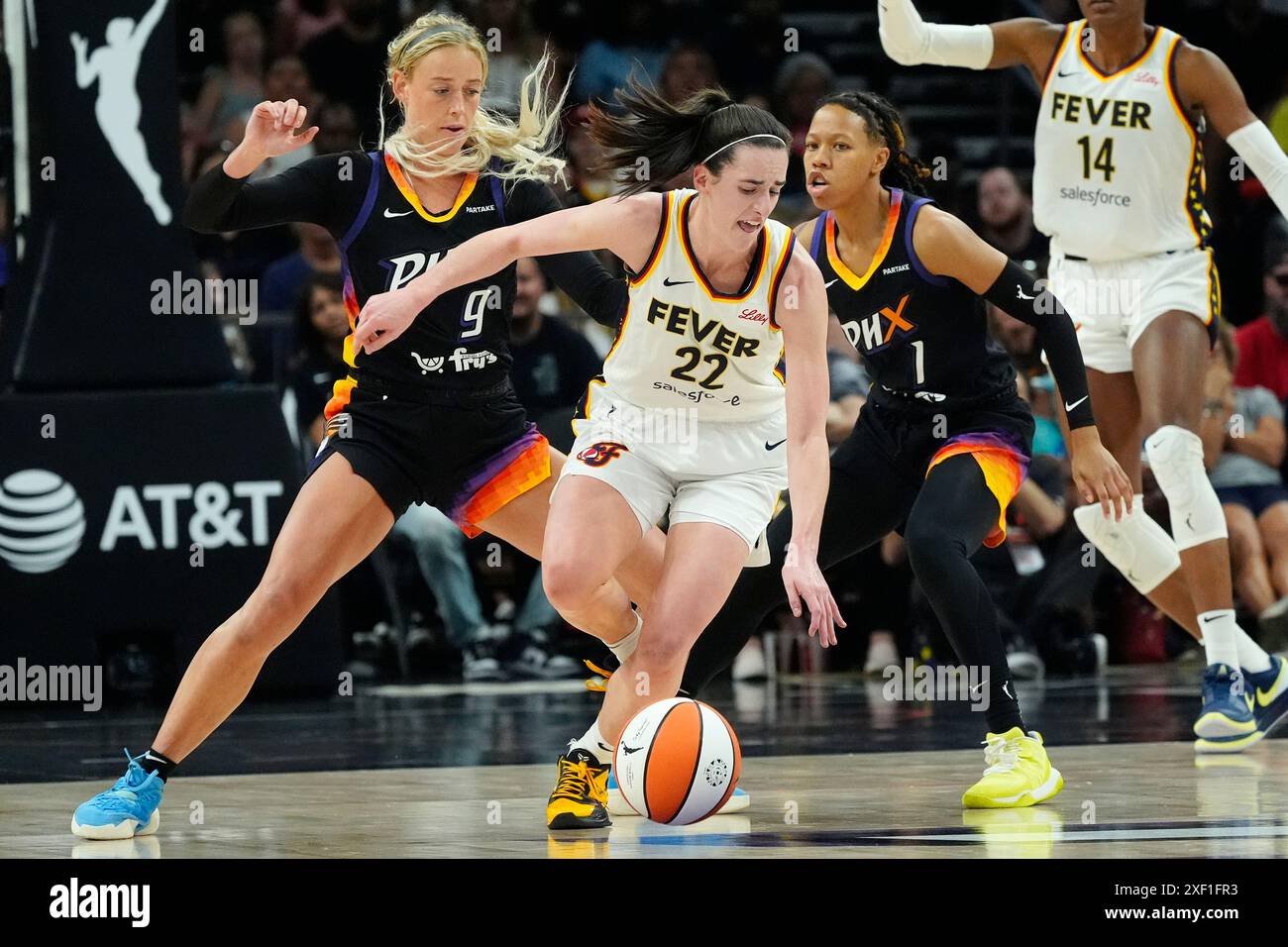 Indiana Fever guard Caitlin Clark (22) is defended by Phoenix Mercury ...