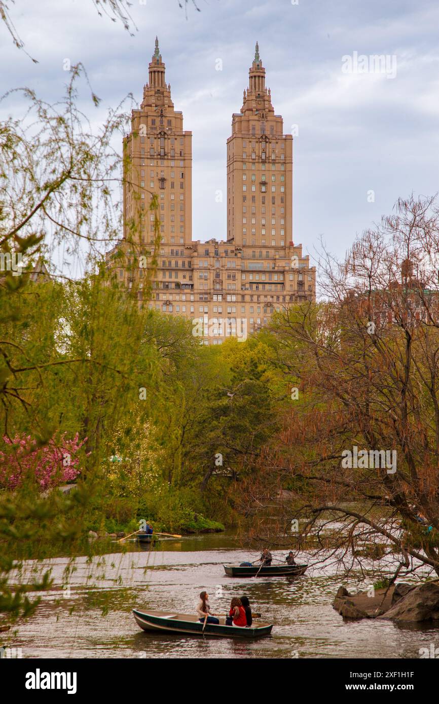 Iconic San Remo building facade and tourists rowing on the lake in ...